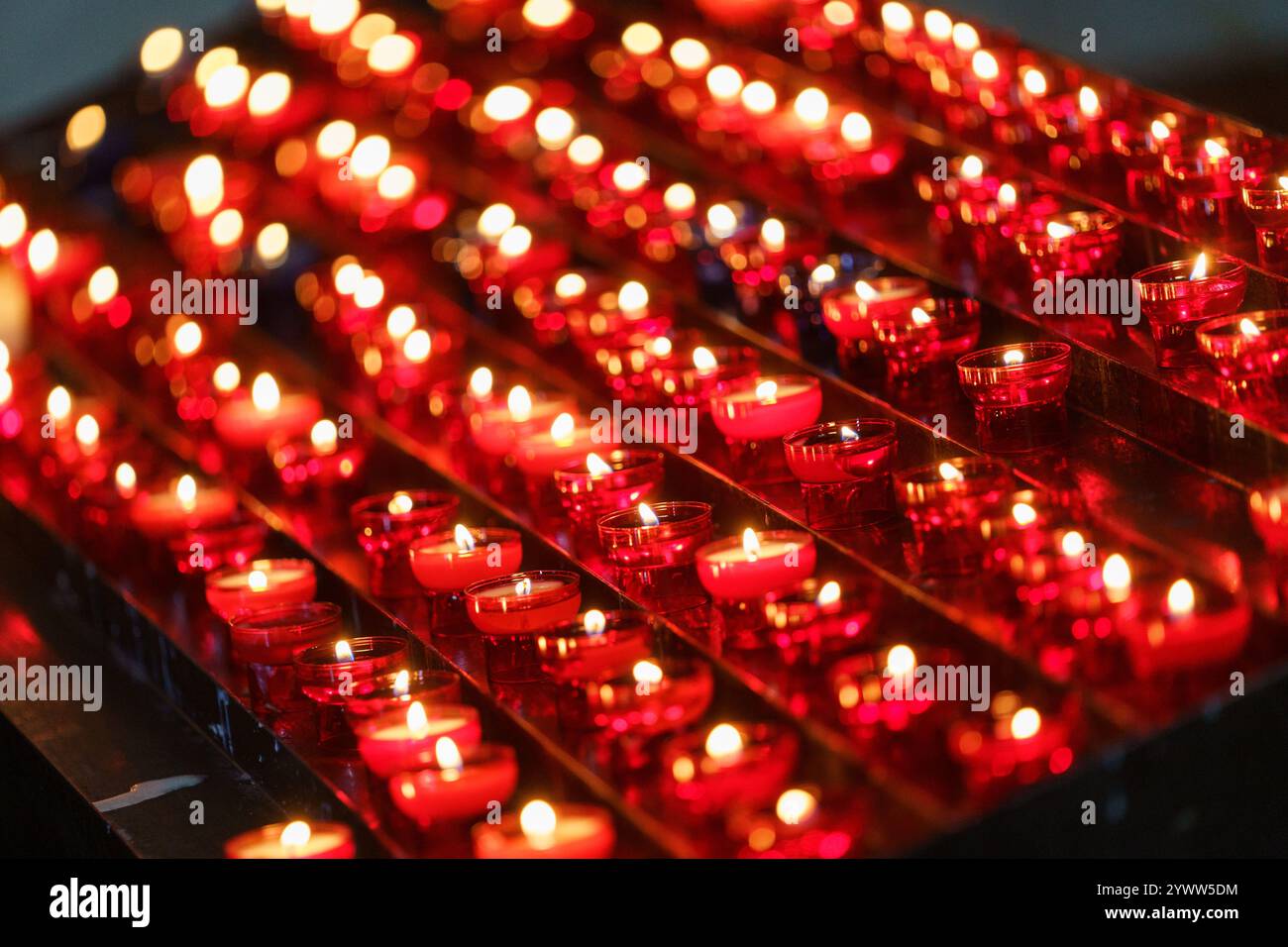 Beautiful, colorful small glass candles whose flame gives an amazing ...