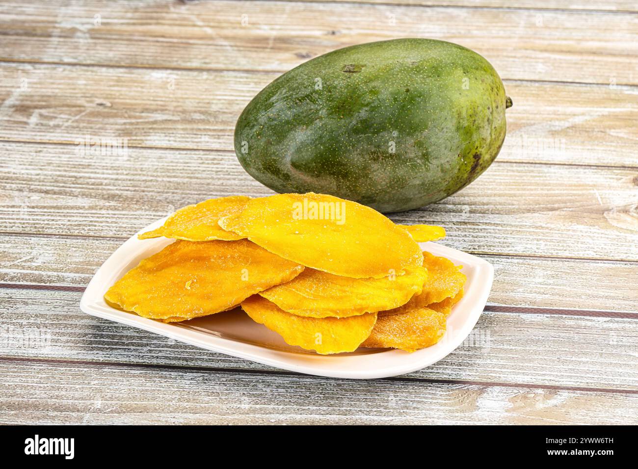 Dry sweet yellow mango snack in the plate Stock Photo - Alamy