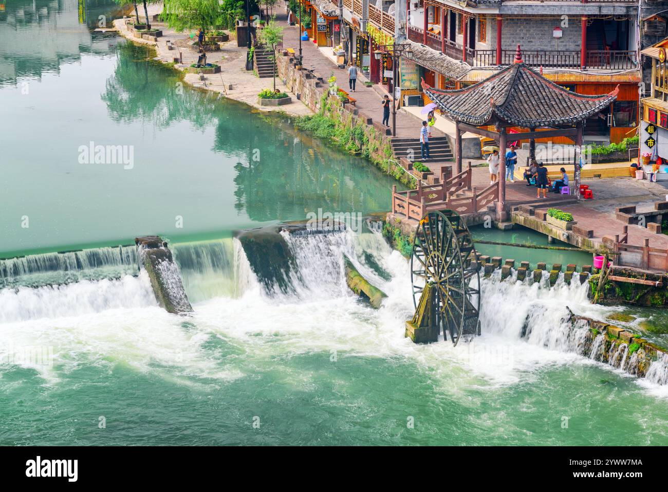 Aerial view of water wheel and waterfall, Phoenix Ancient Town Stock ...