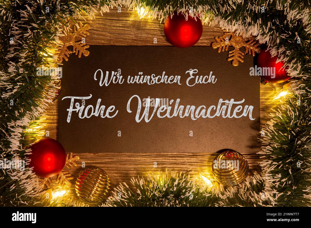 Christmas greetings: Sign with the inscription WIR WÜNSCHEN EUCH FROHE ...