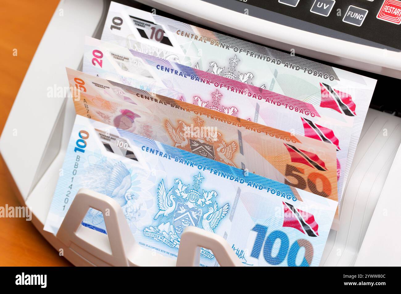 Trinidad and Tobago money - dollar in the counting machine Stock Photo ...