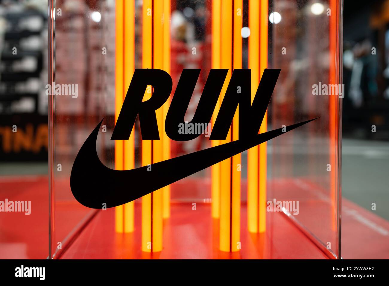 NIKE logo. Neon Nike logo in the interior of the Nike brand store. Nike ...