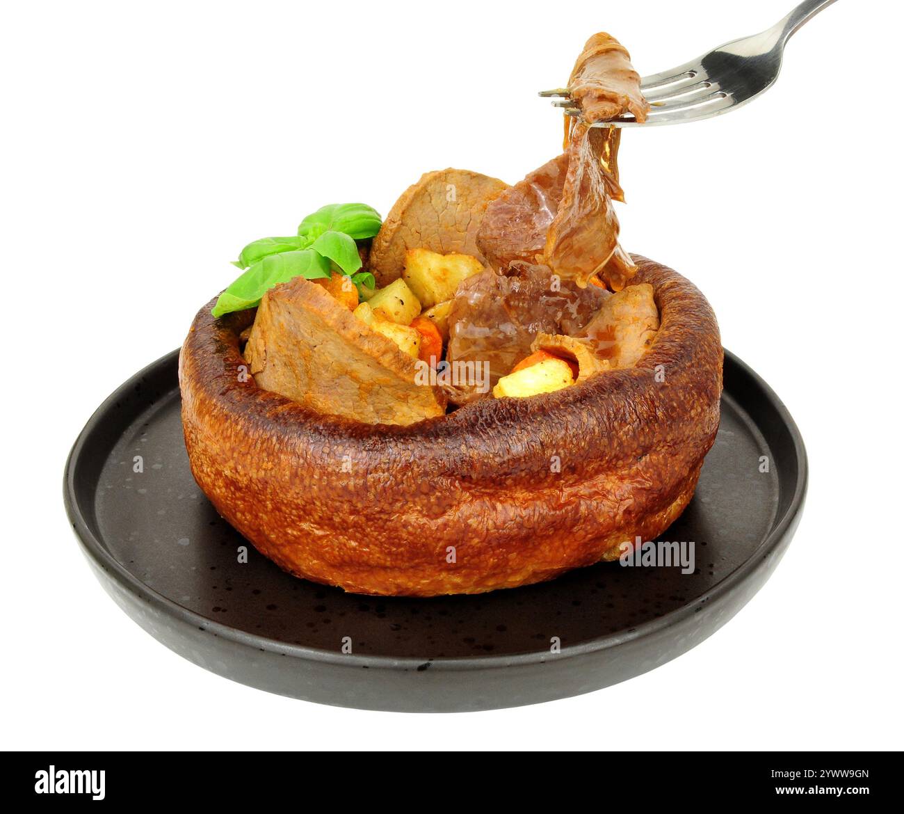 Roast beef dinner in a Yorkshire pudding meal with tender slices of ...