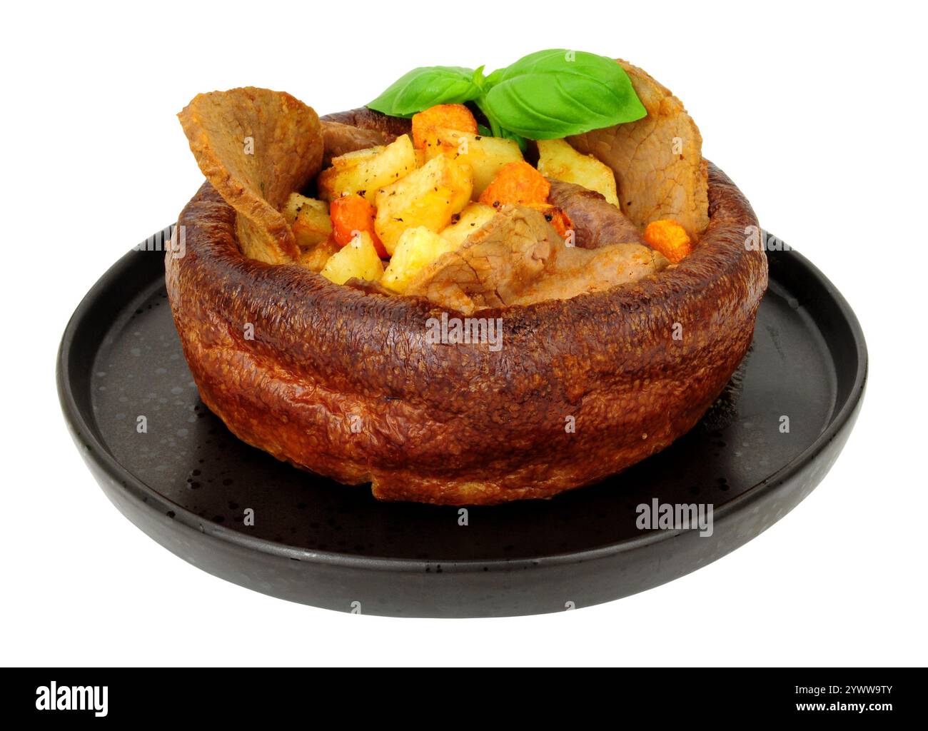 Roast beef dinner in a Yorkshire pudding meal with tender slices of ...