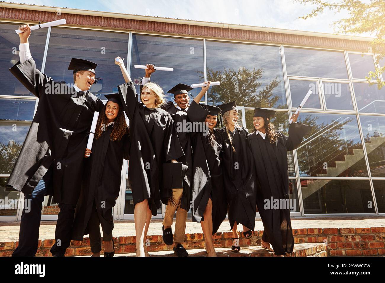 Graduation, diploma and success with students in college for education ...