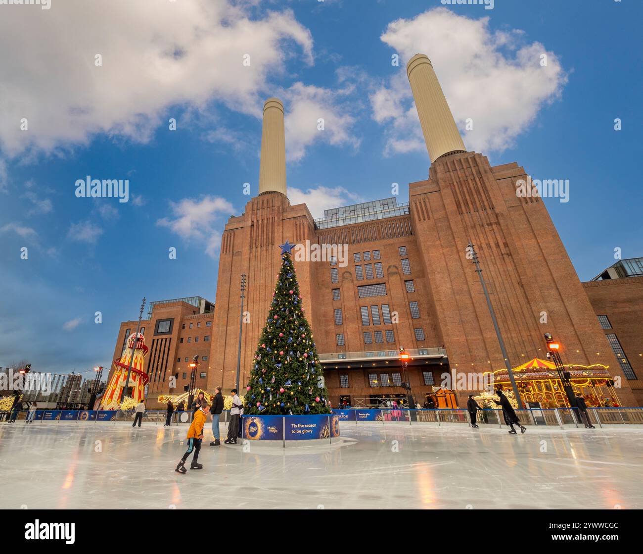 Skaters on the ice rink at Battersea Power Station at Christmas. London ...