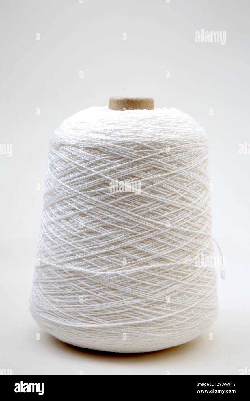 White Machine Knitting Yarn Cone Cotton Stock Photo - Alamy