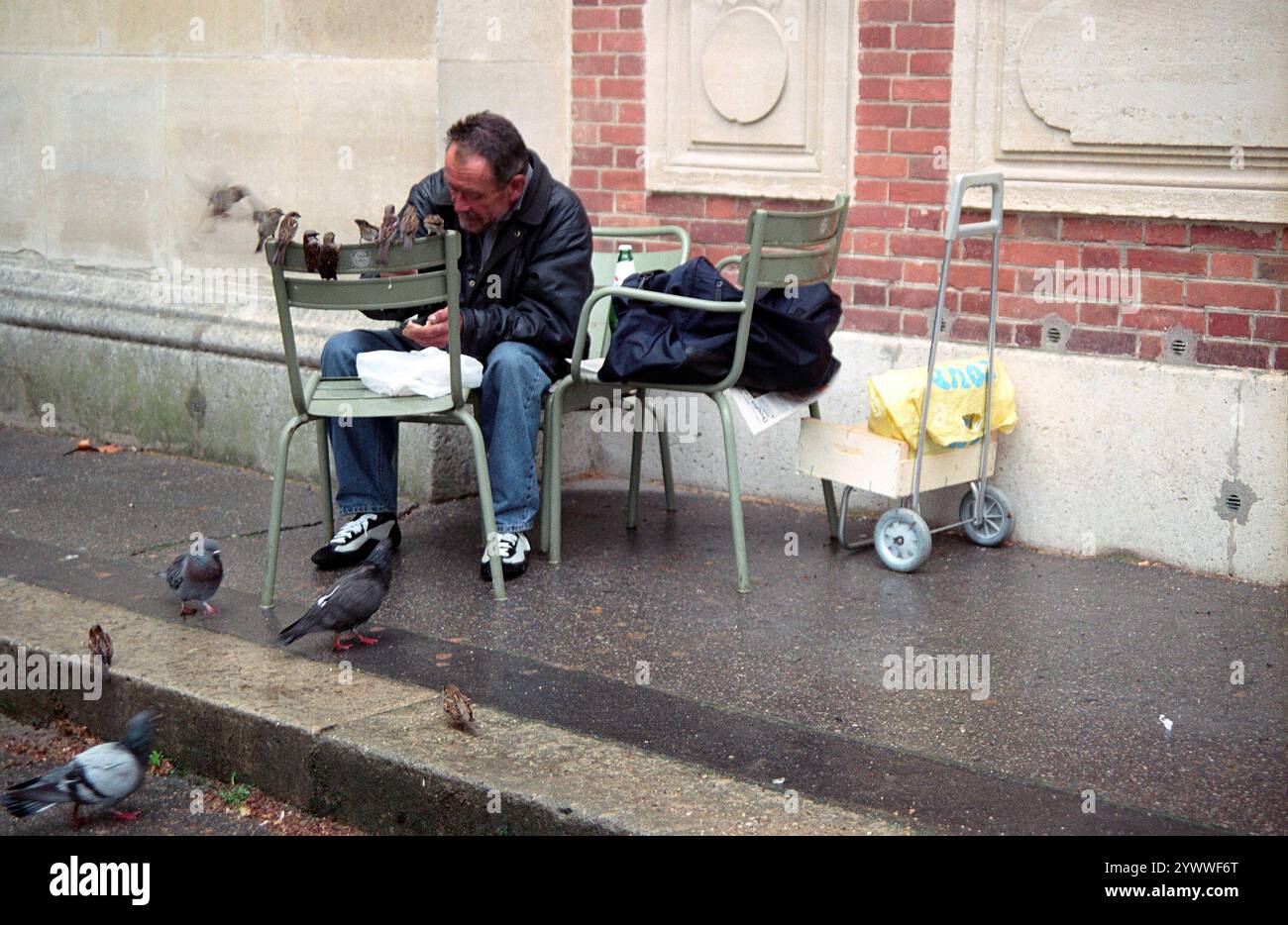 Mature homeless man eating hi-res stock photography and images - Alamy