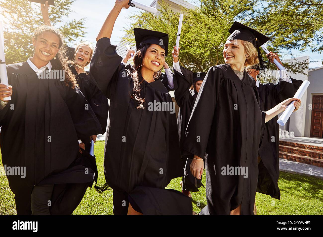 Students, women and graduation celebration with certificate for ...