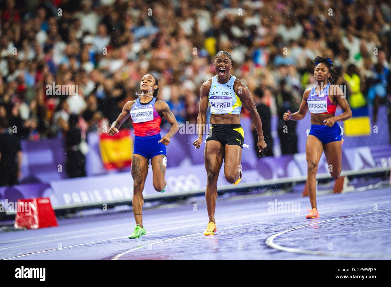 Julien Alfred winning in the 100 meters relay at the Paris 2024 Olympic ...