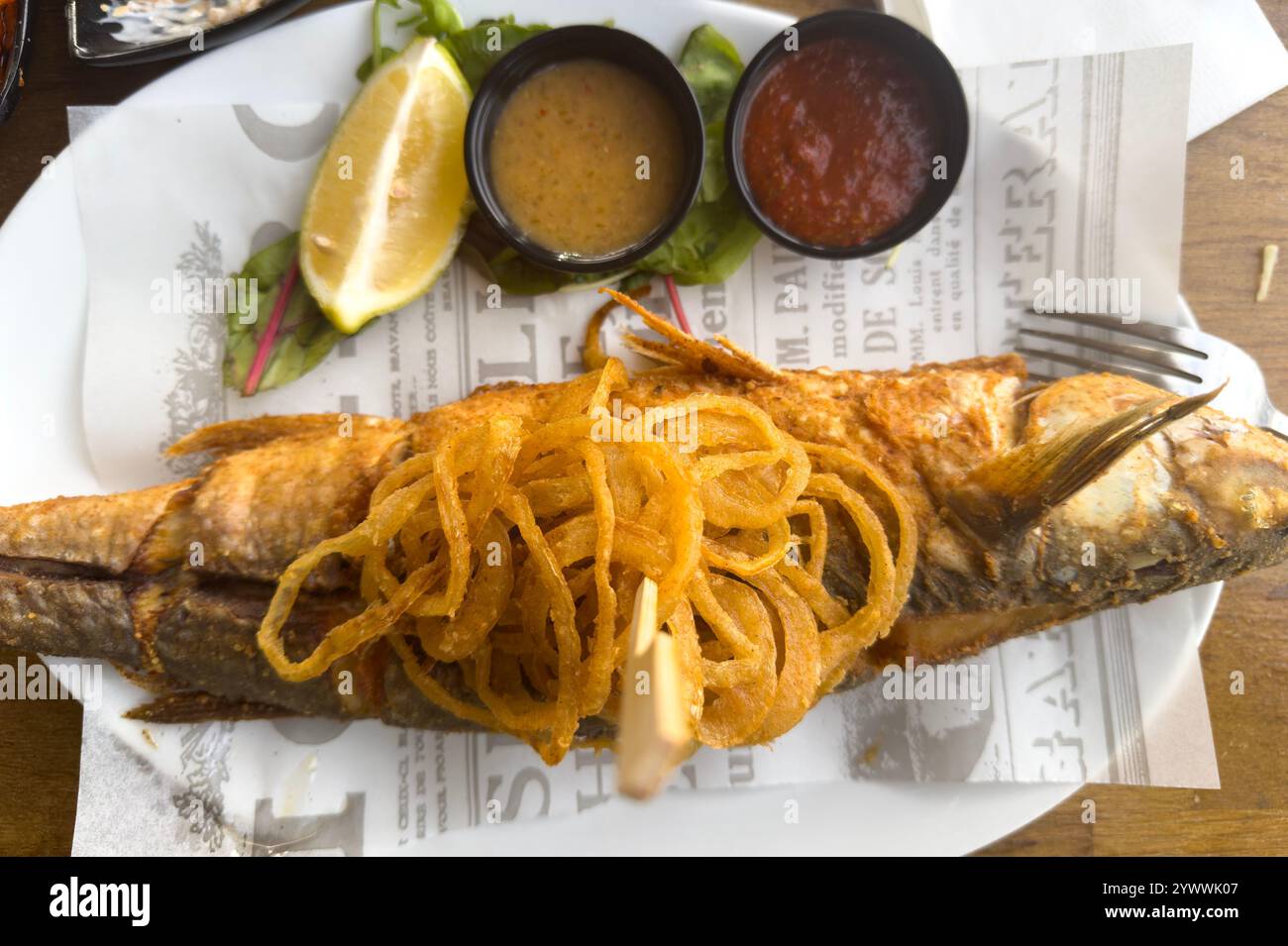 Fried flathead grey mullet fish served in Nisso HaDayag restaurant in ...