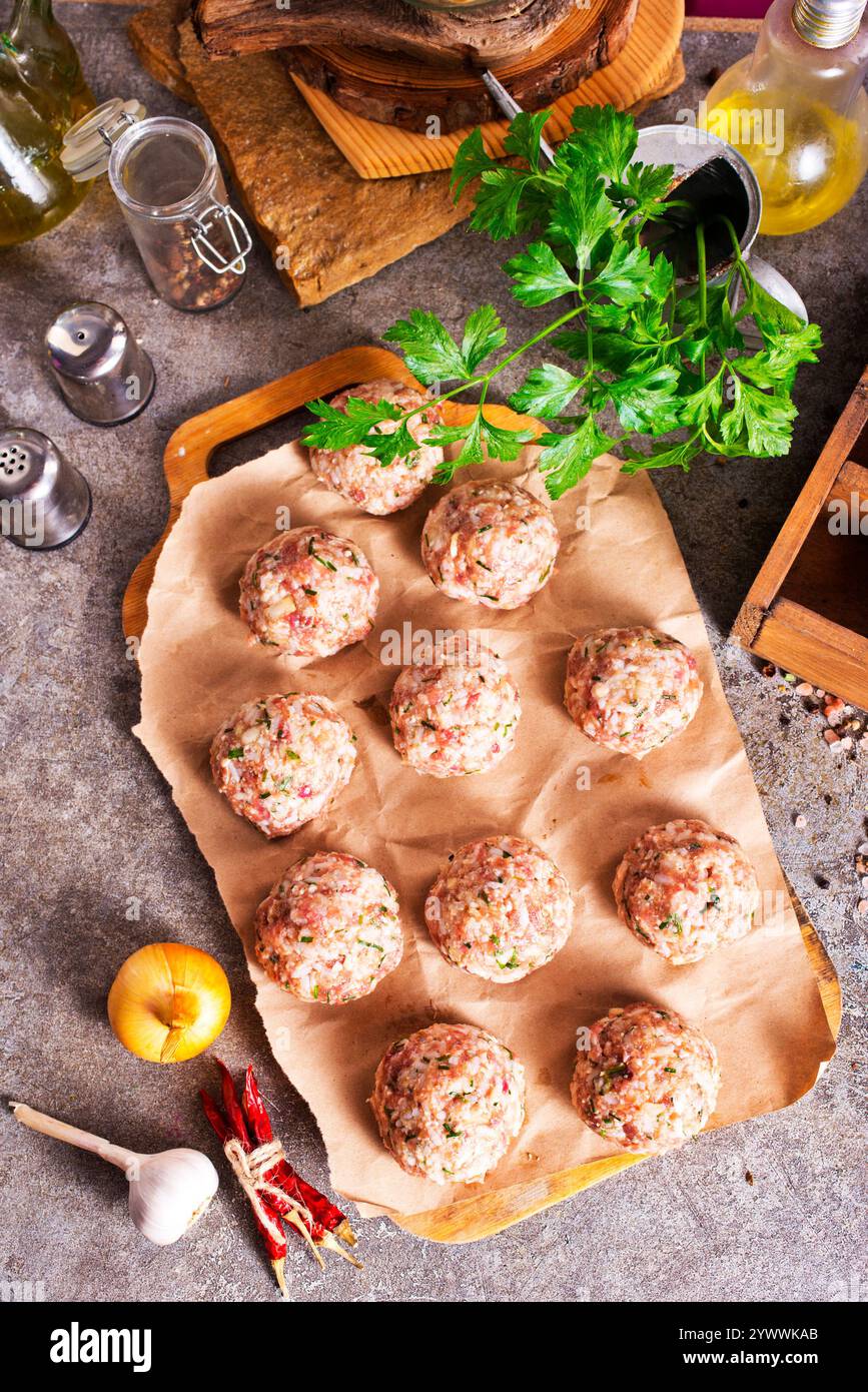 Raw meatball over beton background ready for cooking Stock Photo - Alamy