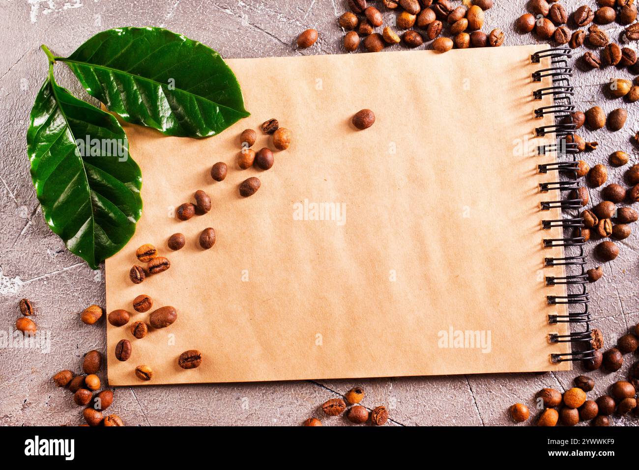 Roasted coffee beans with note on a table, background Stock Photo - Alamy