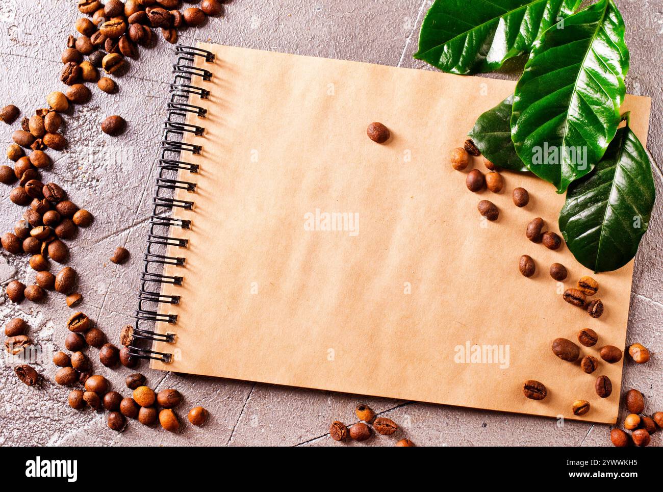 Roasted coffee beans with note on a table, background Stock Photo - Alamy