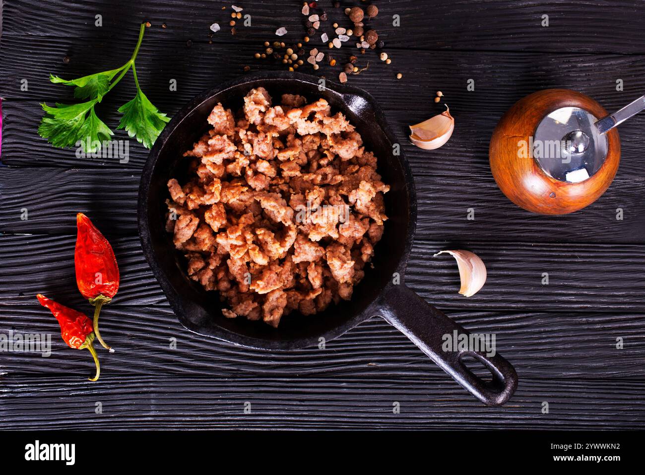 Pan fried minced meat in pan, Gray background. Top view Stock Photo - Alamy