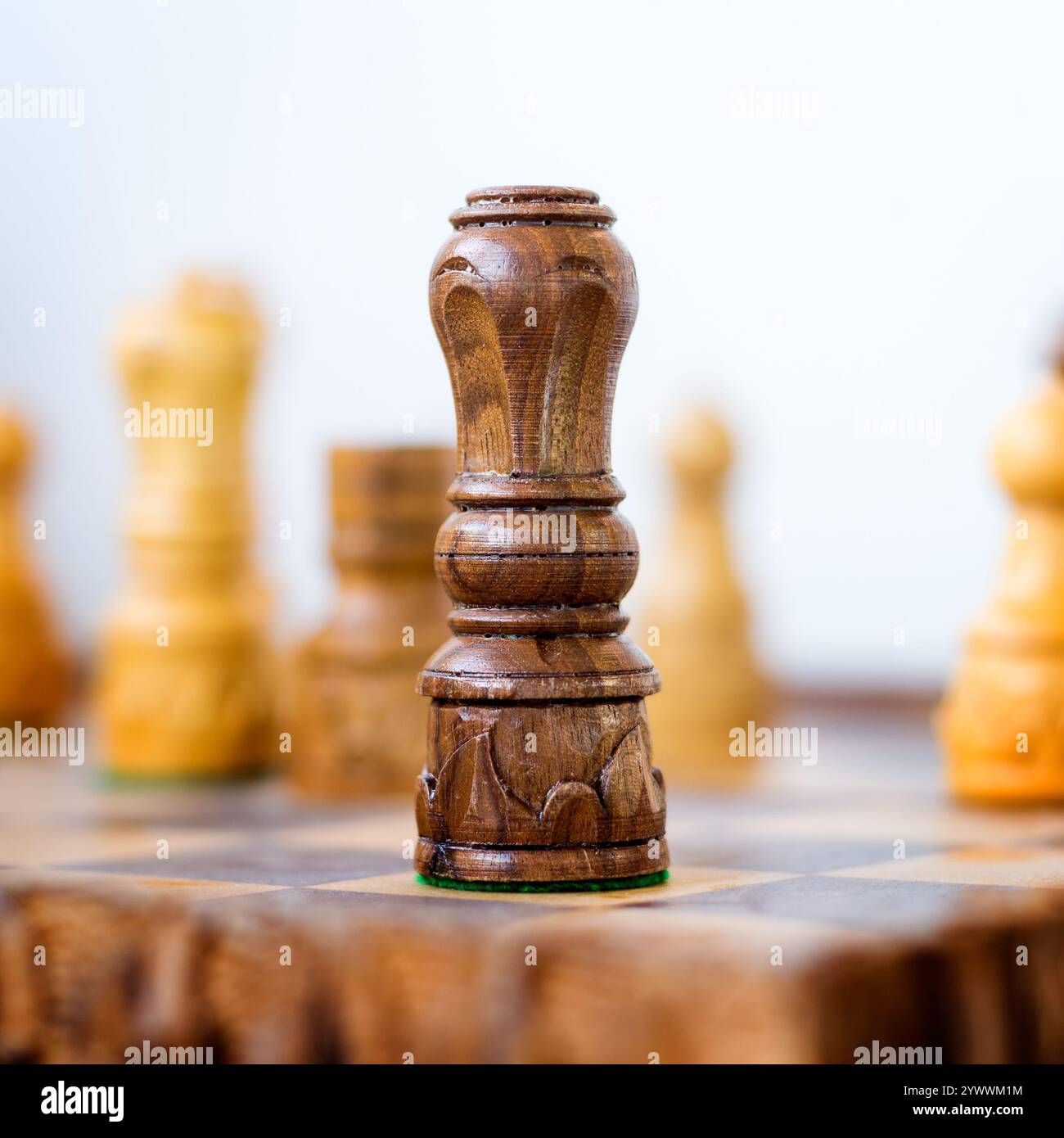 Conceptual photo of chess king standing before the set of another ...