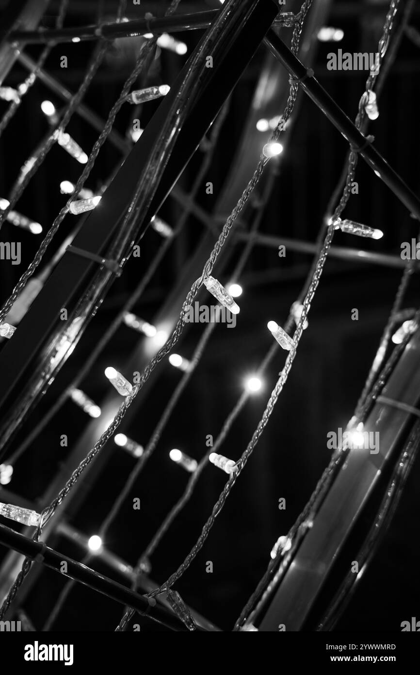 Christmas garland on the street in close-up. Black and white photo ...