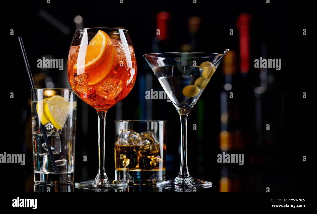 Various cocktails on a bar table. The colorful bokeh of illuminated ...