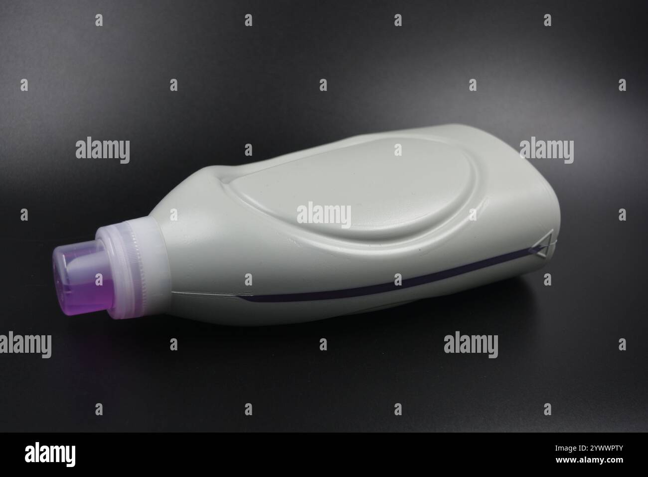 A large gray bottle for washing clothes, bed linen, fabrics. A plastic ...