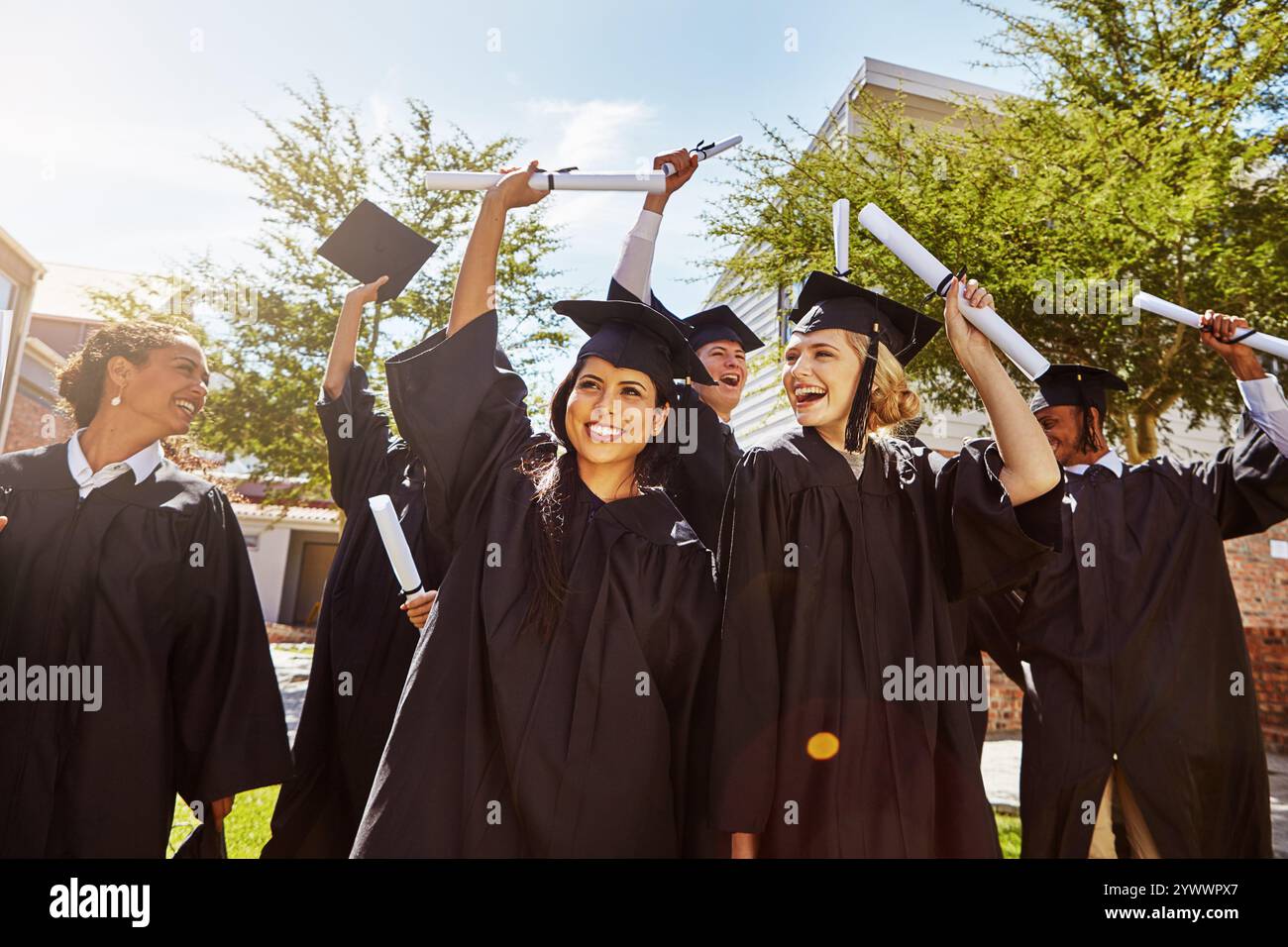 Students, excited and graduation celebration with diploma for education ...