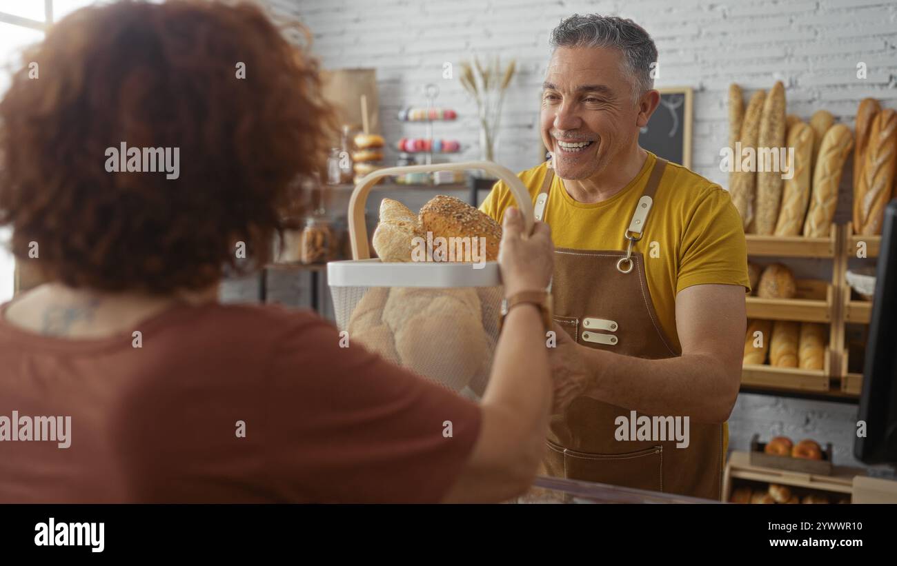 Woman buying bread from smiling man in bakery shop interior with ...