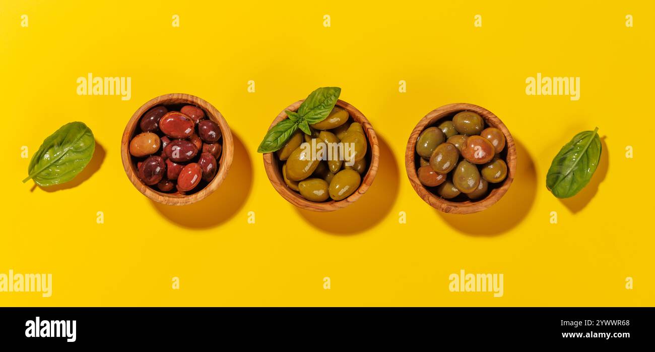 An assortment of various olives presented in a bowl, showcasing ...