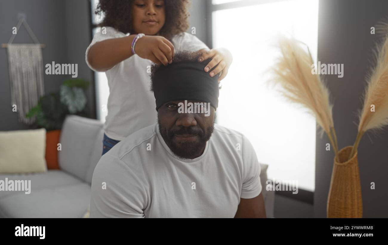 Daughter braiding fathers hair home hi-res stock photography and images ...