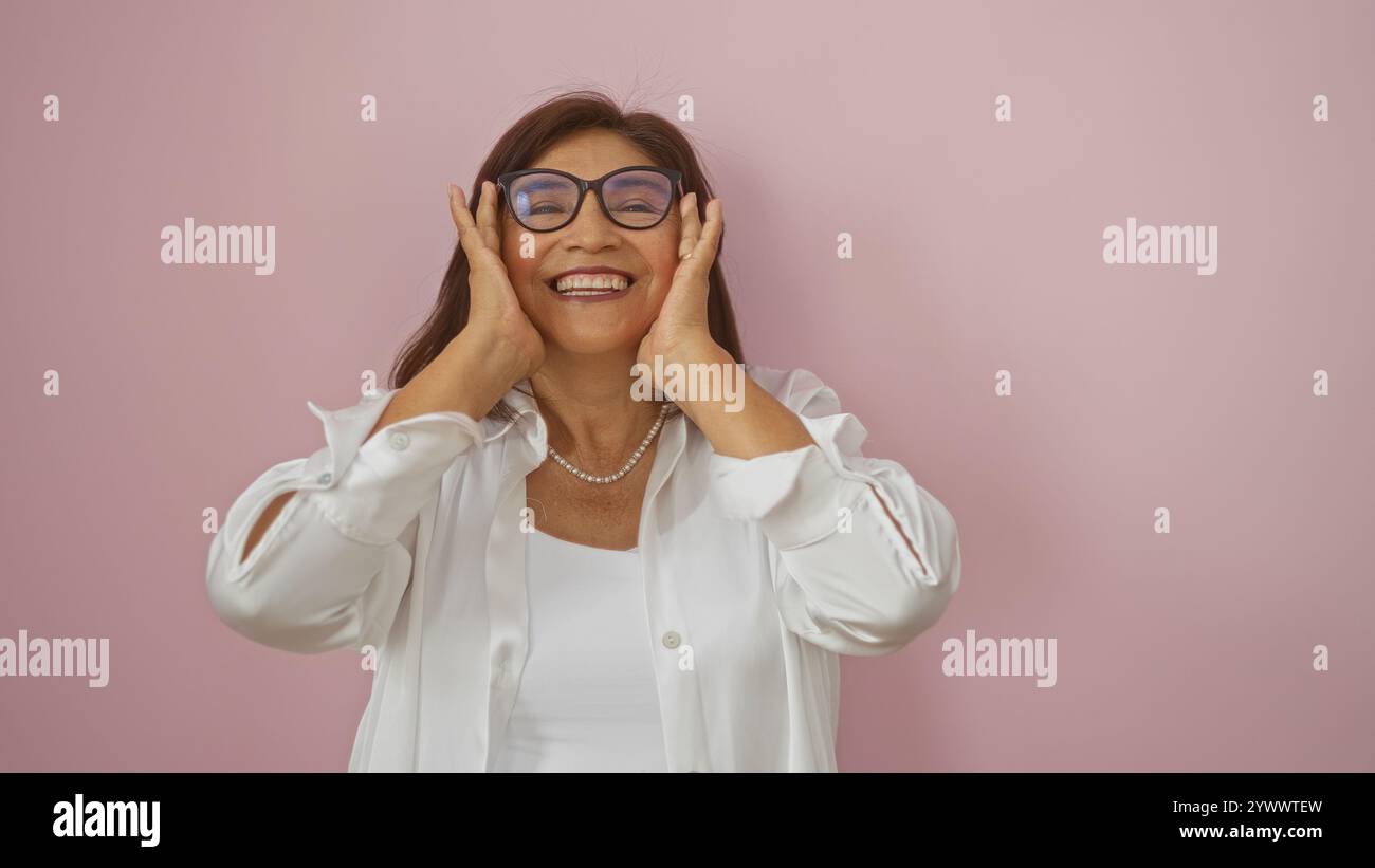 A beautiful middle-aged hispanic woman with short hair and glasses smiles joyfully, isolated ...