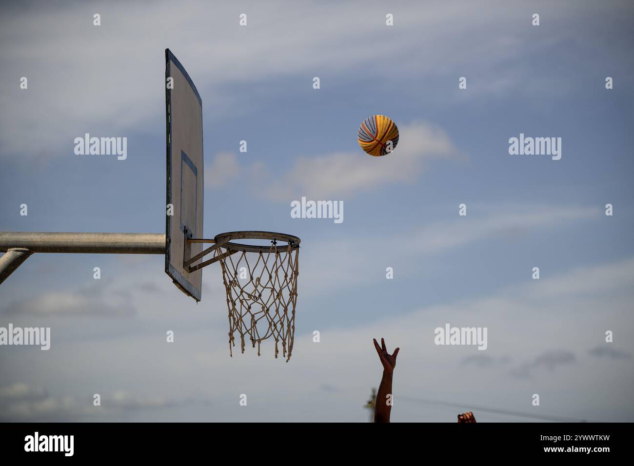 Basketball on its way to the hoop Stock Photo - Alamy