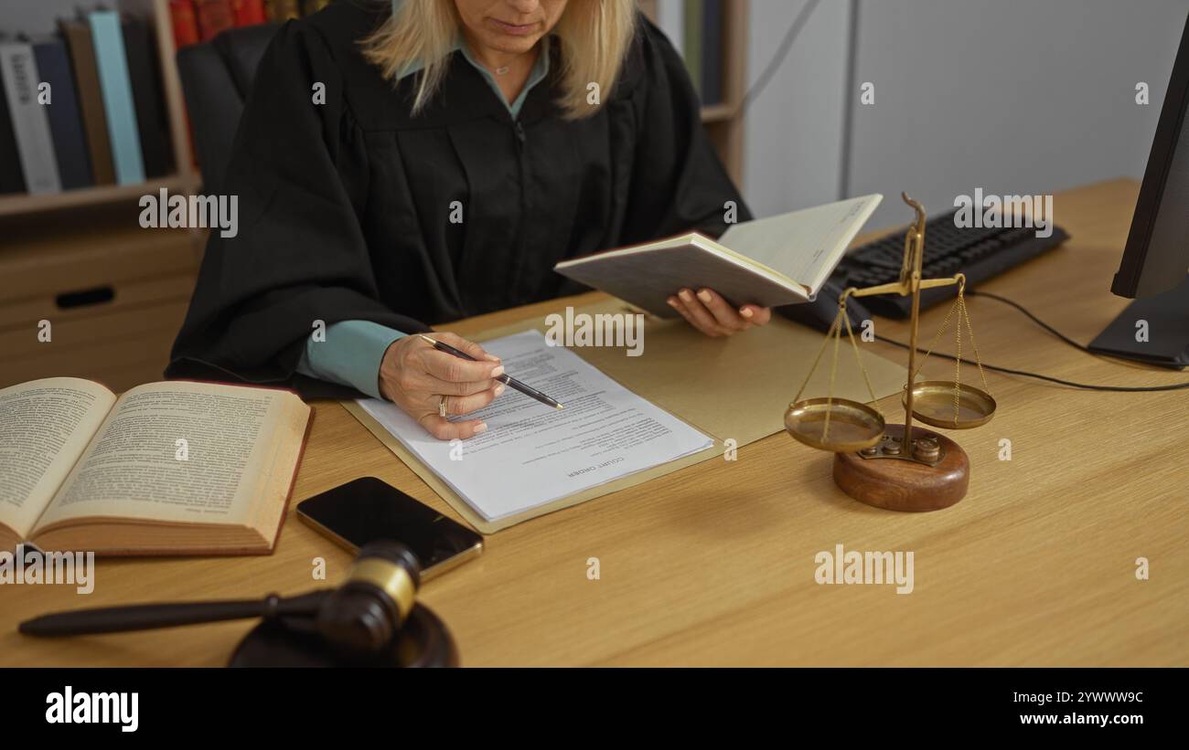 Woman judge working in courtroom with legal documents, scales of ...
