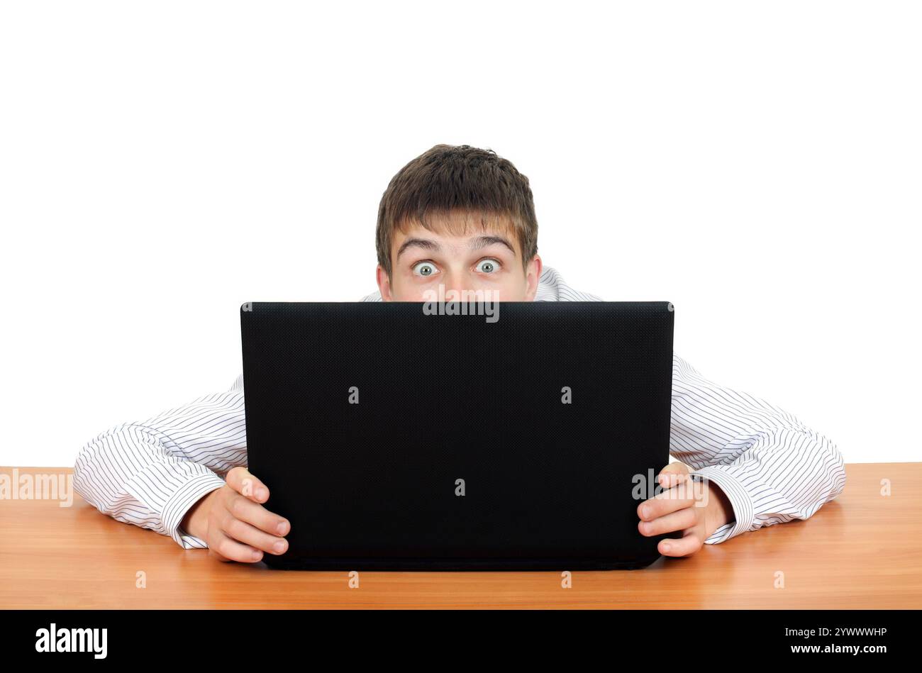 Surprised Young Man behind Laptop. Isolated on the White Background ...