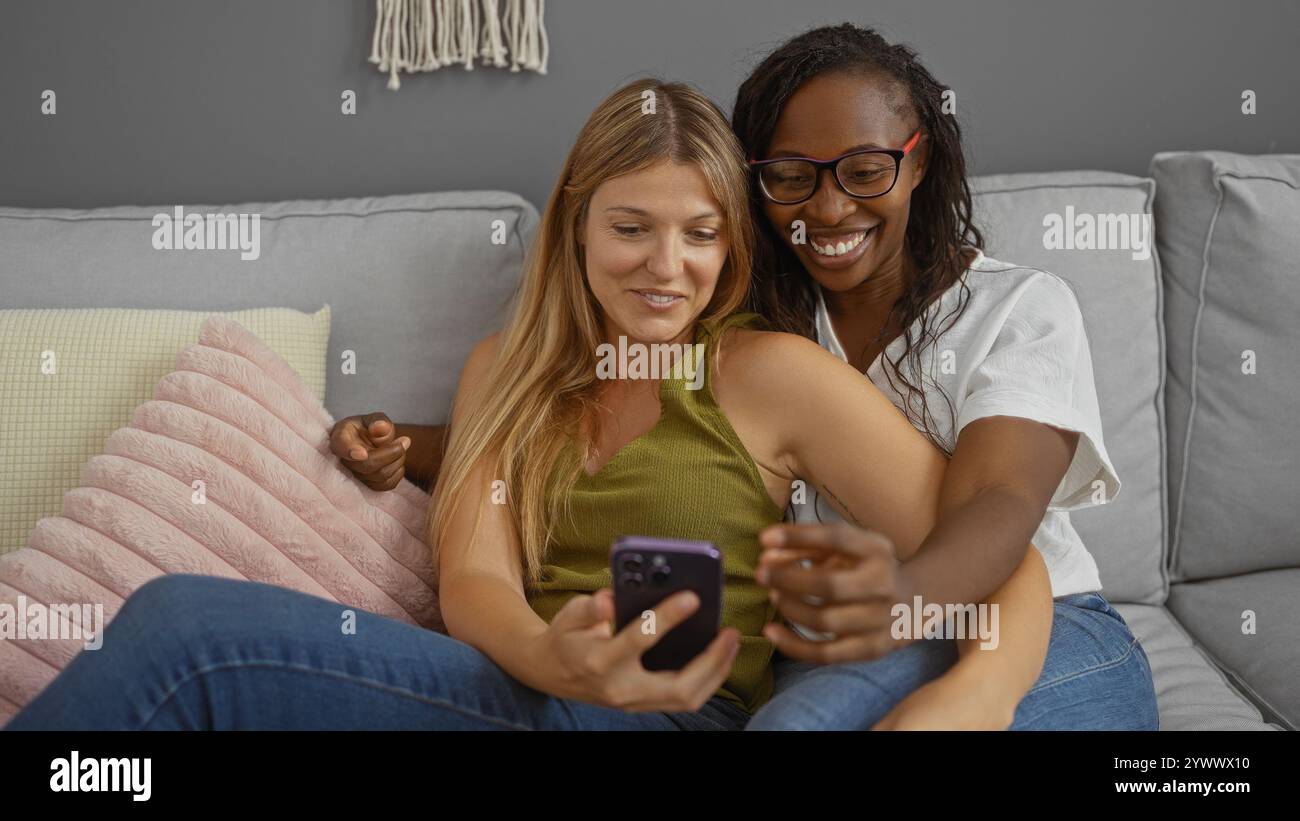 Women chilling on couch hi-res stock photography and images - Alamy