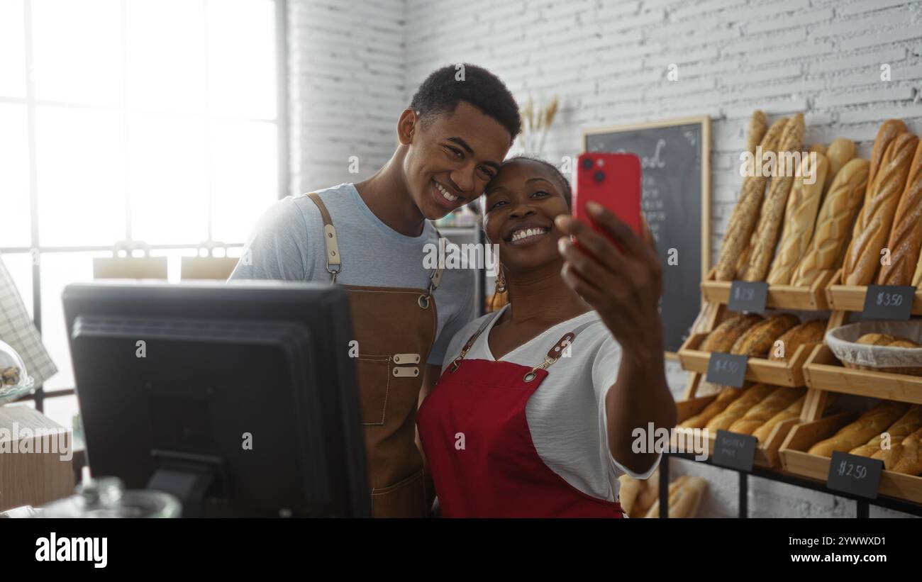 Bakers taking selfie together in a bakery with smiling faces ...