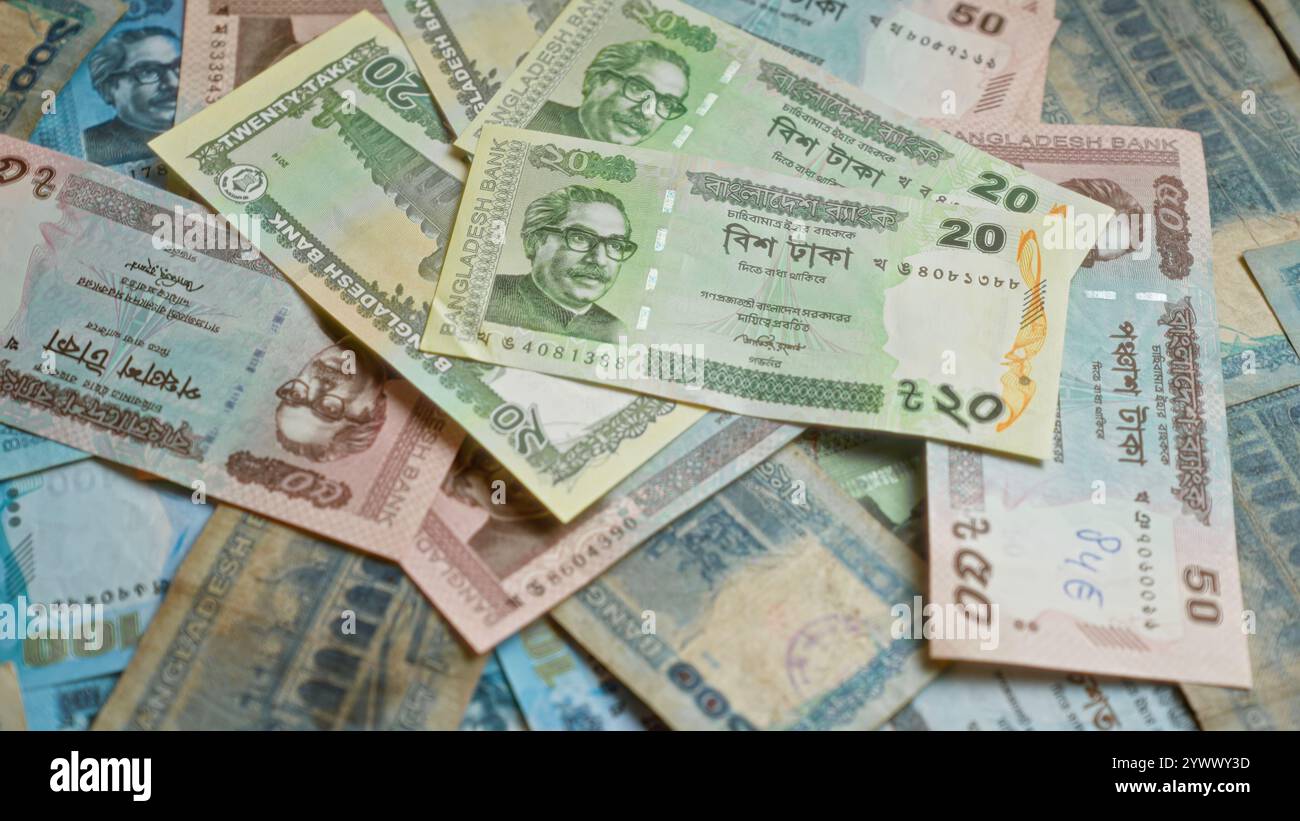 Bangladeshi banknotes scattered on a surface showcasing various ...
