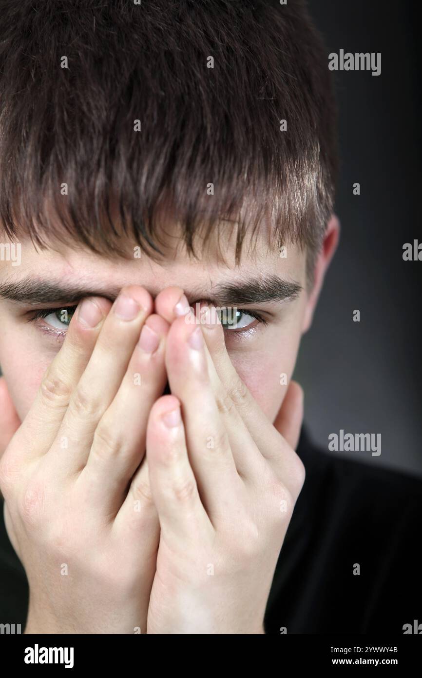 Portrait of Sorrowful Young Man on the Black Background Closeup Stock ...