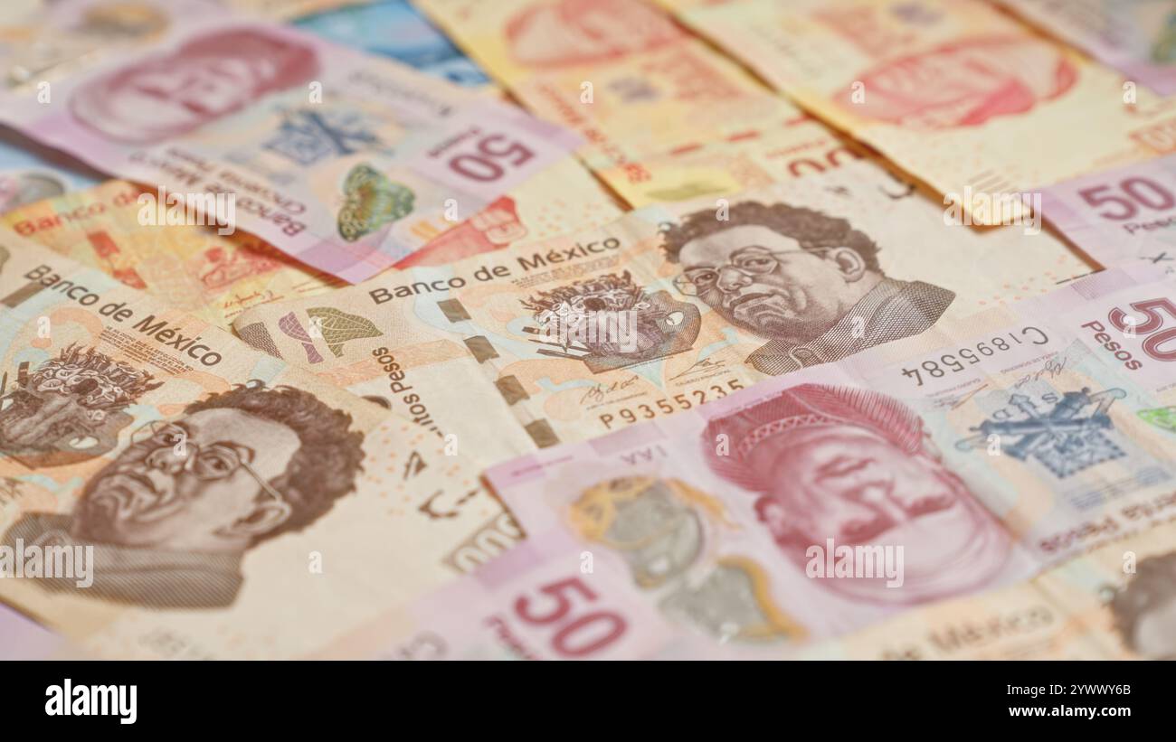 Colorful mexican banknotes scattered featuring various denominations of ...