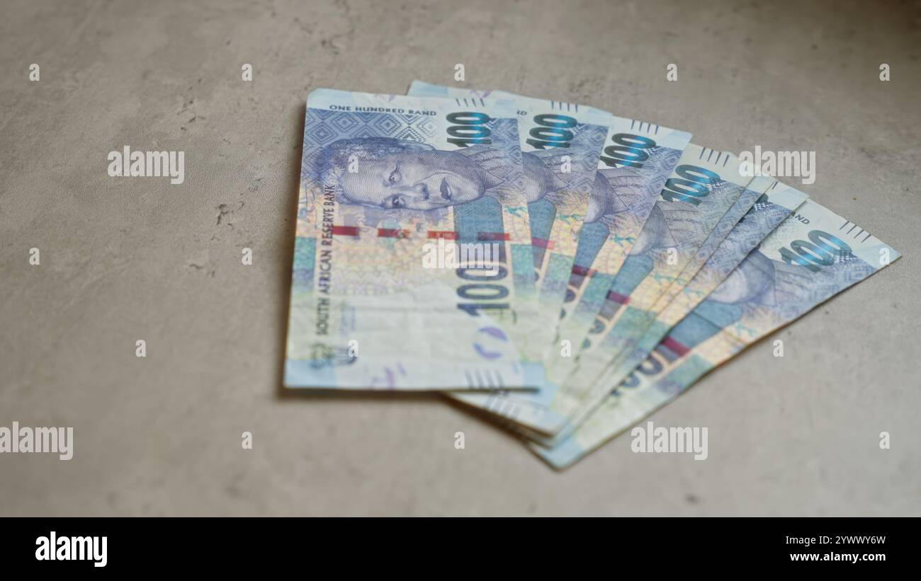 South african banknotes featuring nelson mandela spread out on a ...