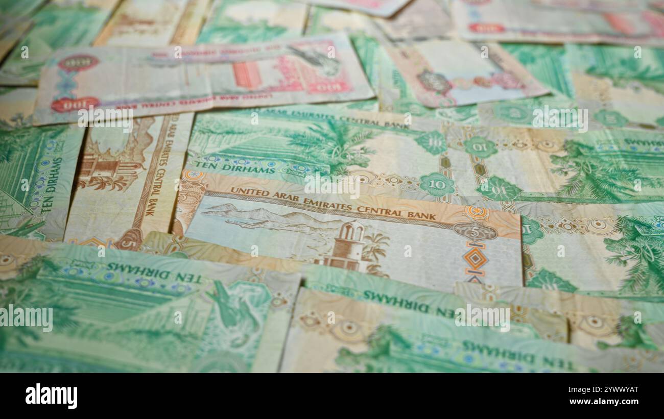 United arab emirates banknotes arranged neatly, showcasing various ...