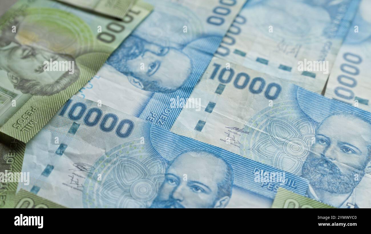 Chilean banknotes in denominations of 10000 pesos featuring historical ...