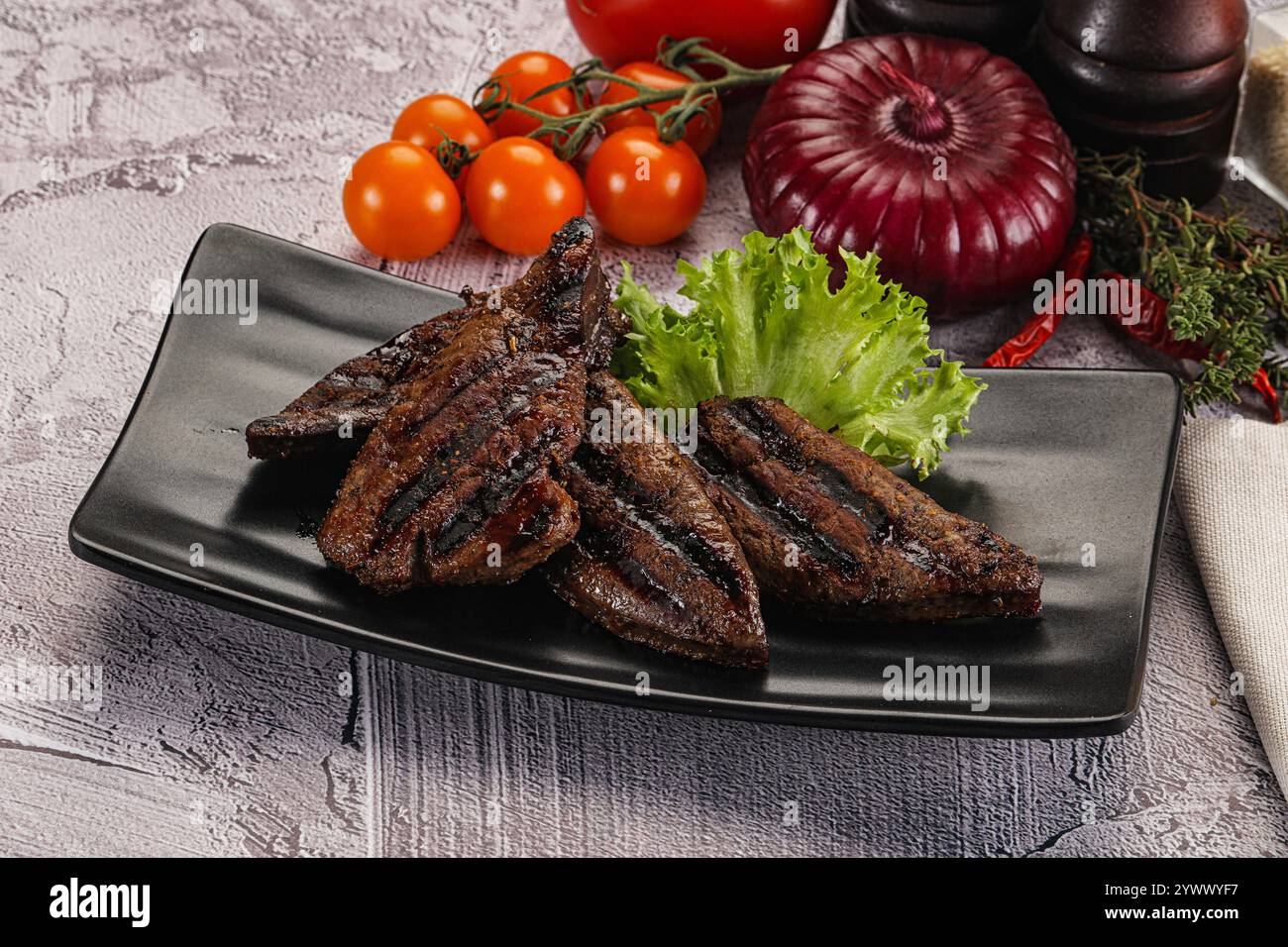 Grilled diet beef liver steak in the plate Stock Photo - Alamy