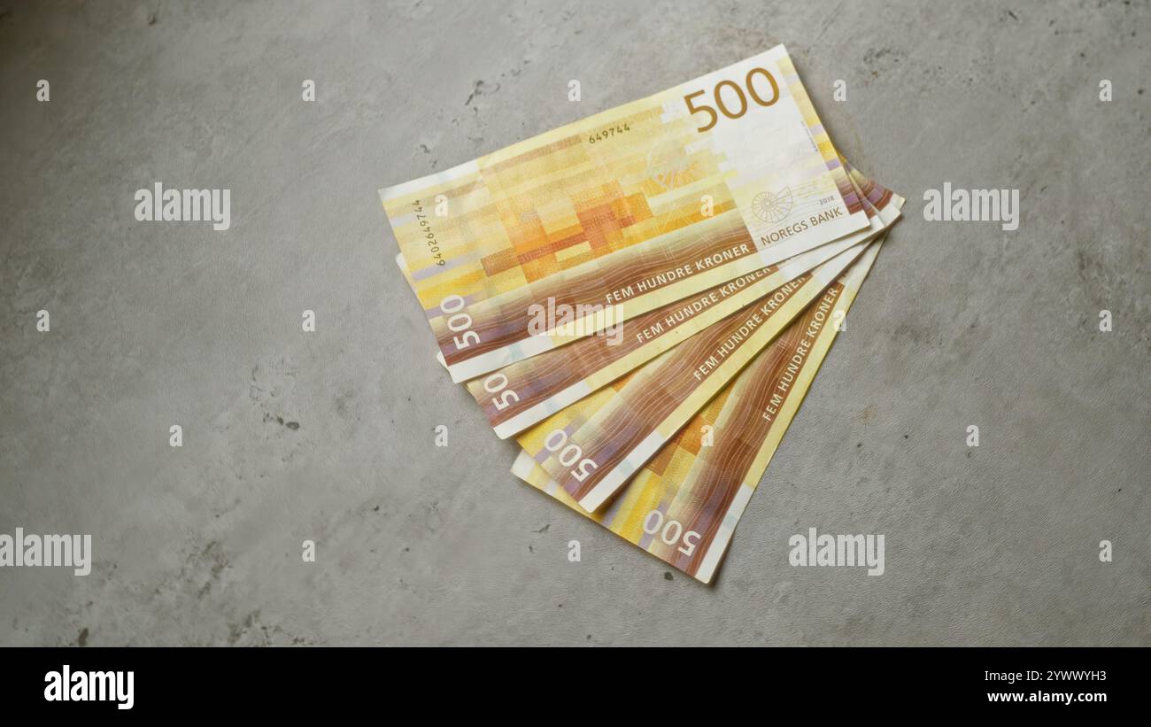Norwegian banknotes in denominations of 500 kroner arranged fan-like on ...