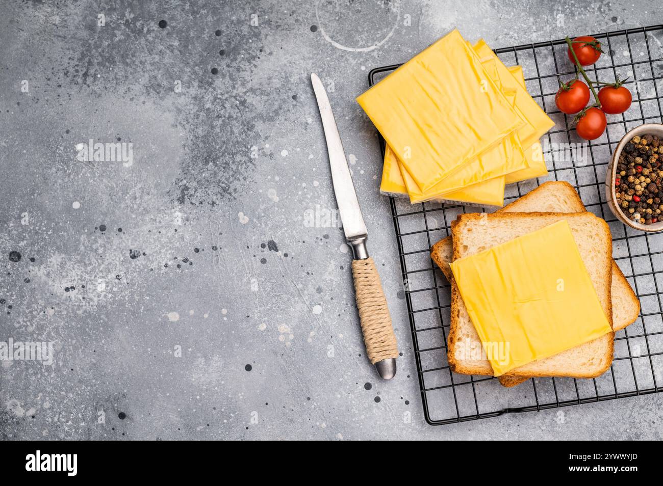 Square Slices of processed Cheddar cheese in individual plastic ...