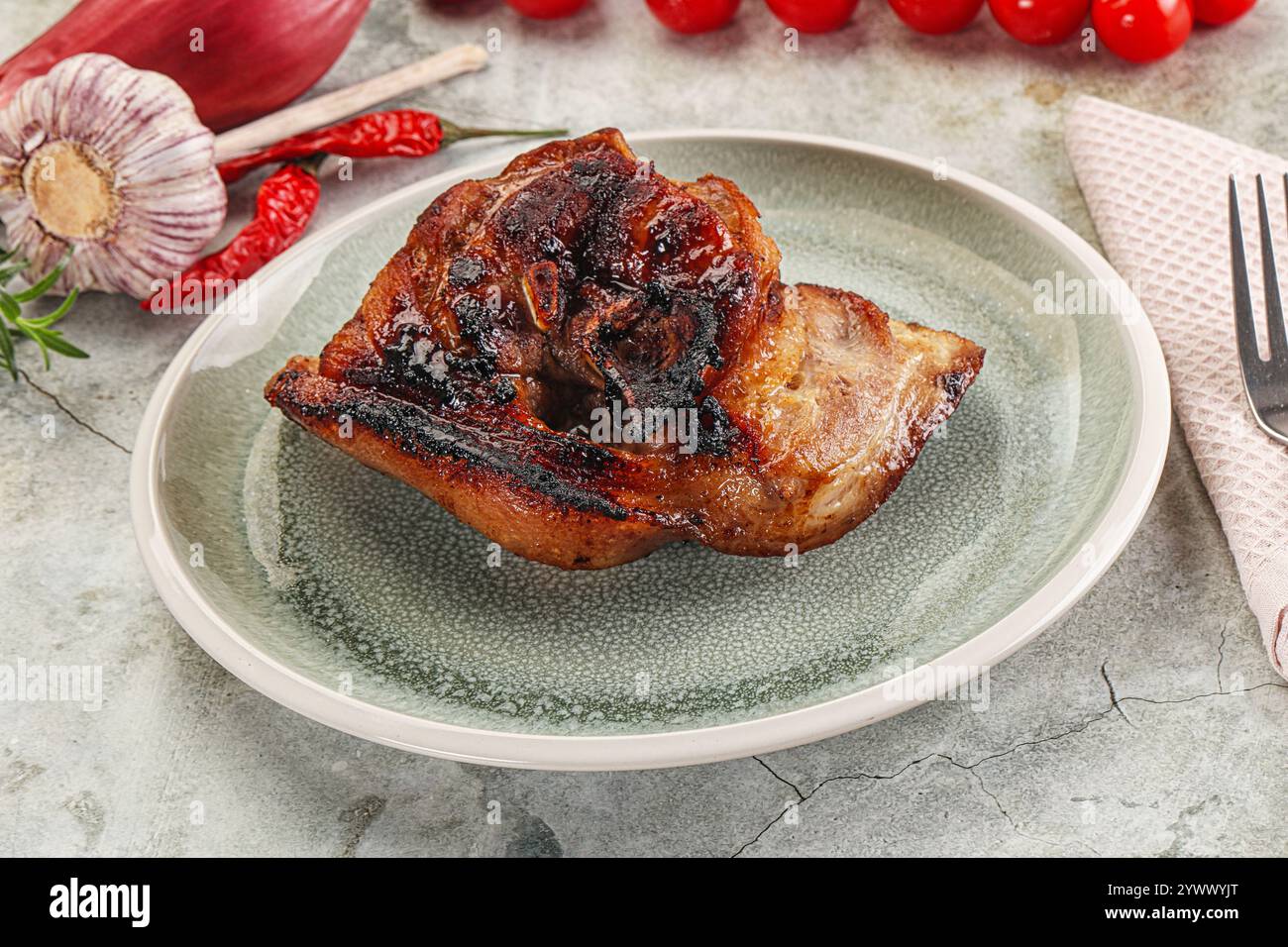 Roasted pork knuckle steak with bone Stock Photo - Alamy