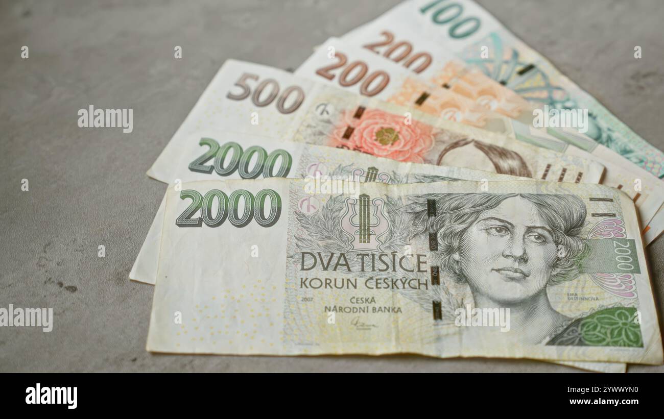Czech banknotes on a concrete surface highlighting the currency of the ...