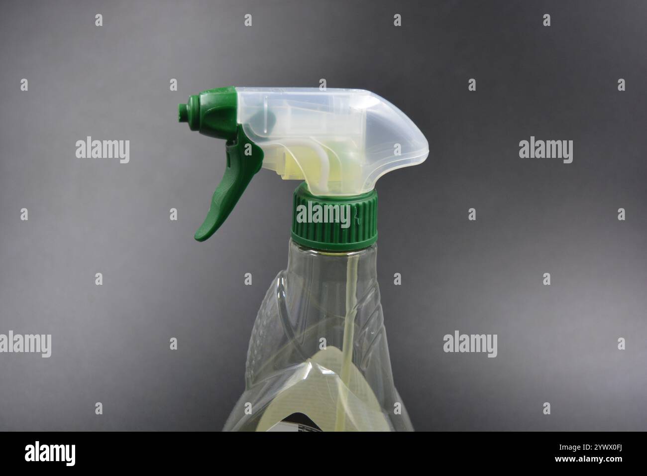 Clear, white matte bottle with green clear spray, window cleaner, glass ...