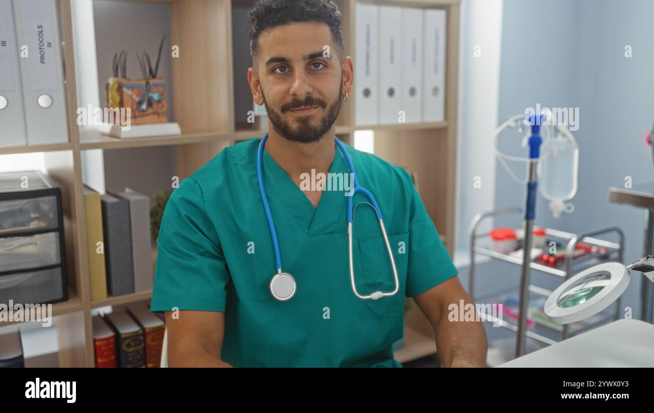 Young hispanic male nurse in a hospital room wearing green scrubs and a ...