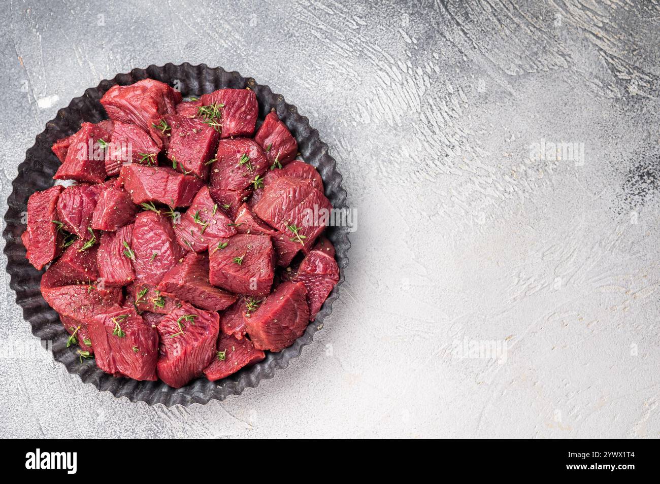 Ready for cooking Diced Raw kangaroo meat. white background. top view ...
