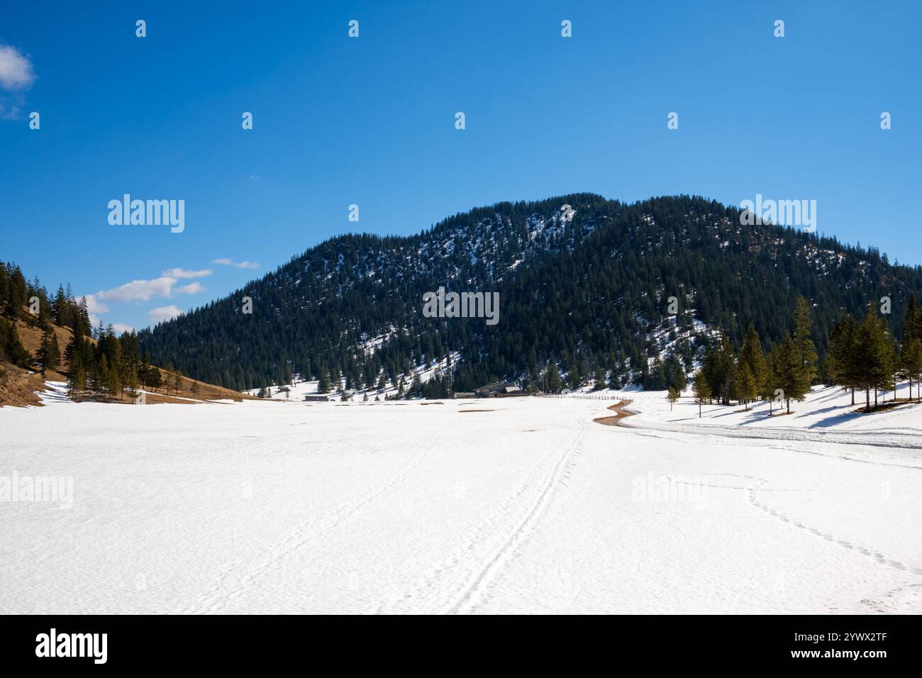 Snow covers the expansive field in Garmisch-Partenkirchen, with distant ...