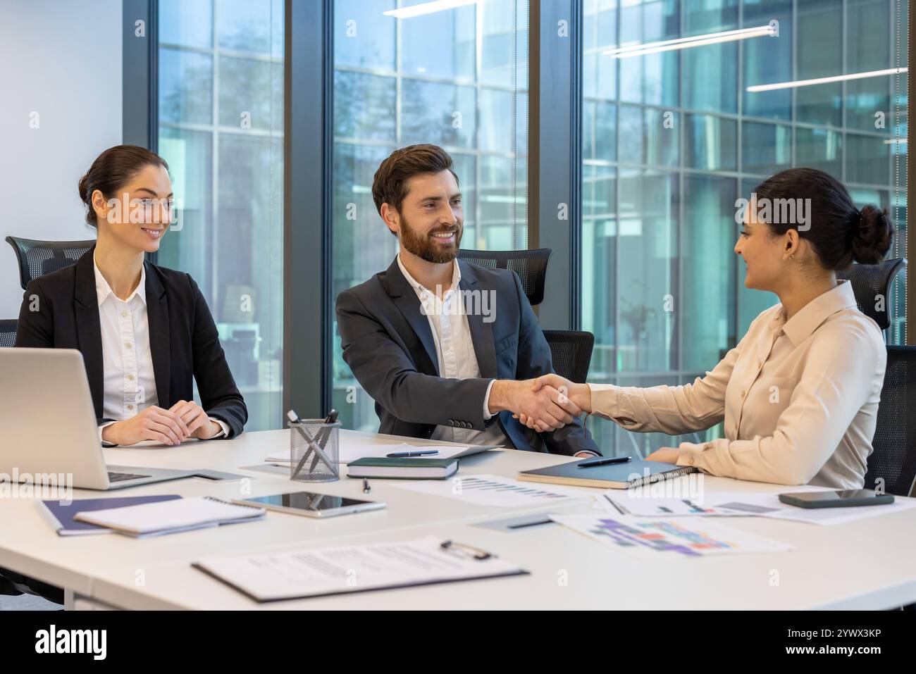 Business partnership handshake through hi-res stock photography and ...