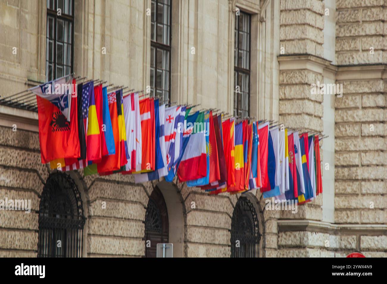 Vienna, Austria - May 12, 2019: Many flags of the world on the facade ...